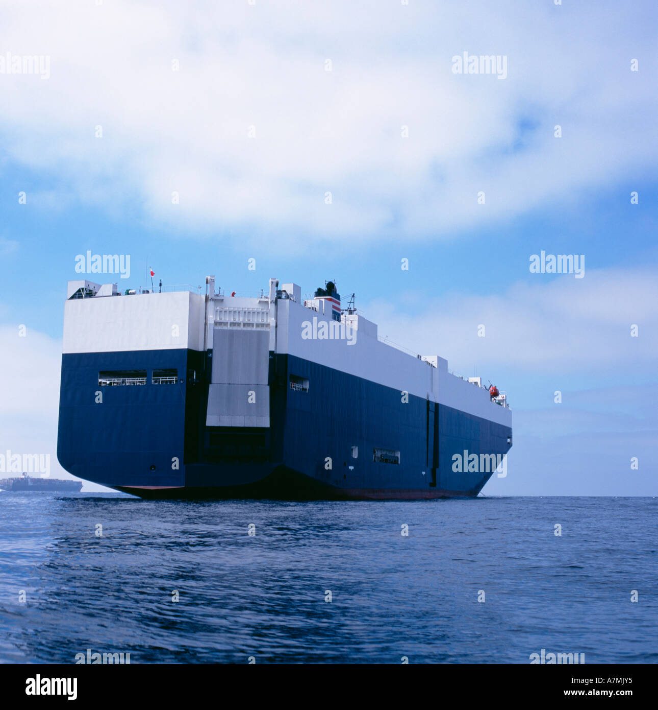 Rear view of cargo ship sailing at sea Stock Photo - Alamy