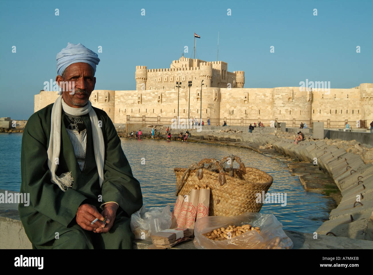 Egyptian man selling peanuts at the Fortress of Qaitbey, Alexandria ...