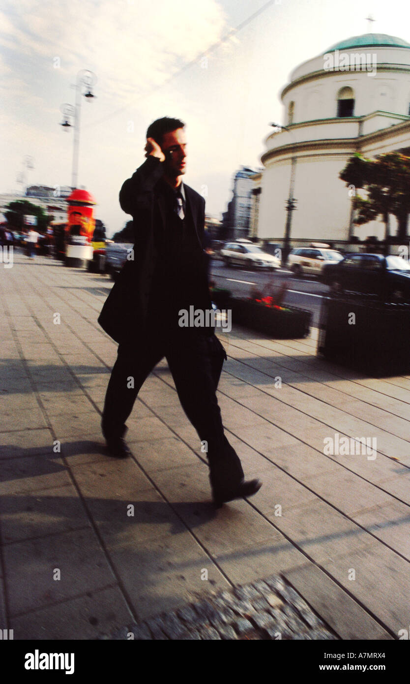 Young man walking on the street Stock Photo - Alamy