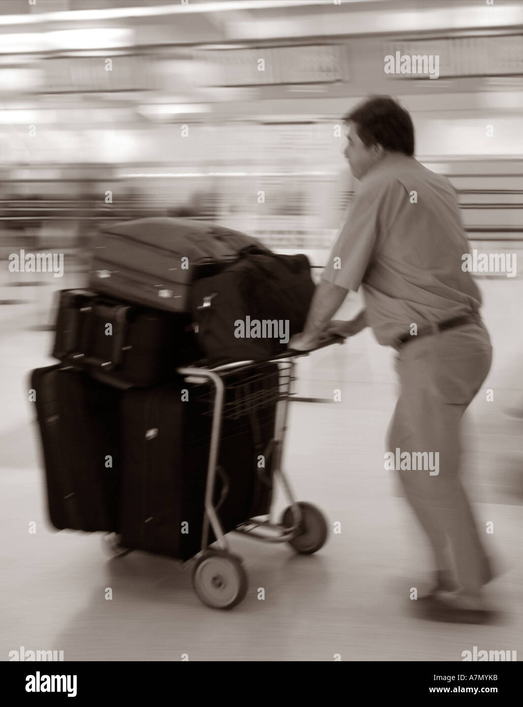 Man rushing at Airport Stock Photo - Alamy