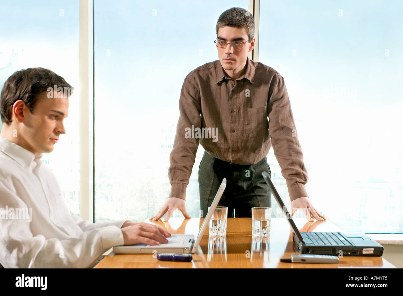 Two young men in the office Stock Photo - Alamy