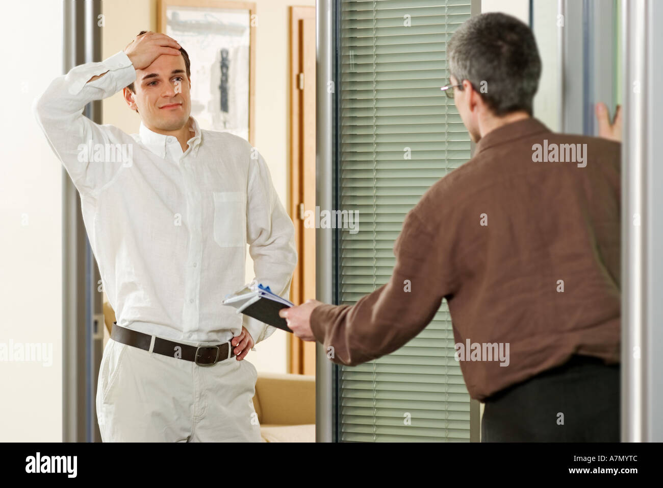 Two men in the office Stock Photo - Alamy