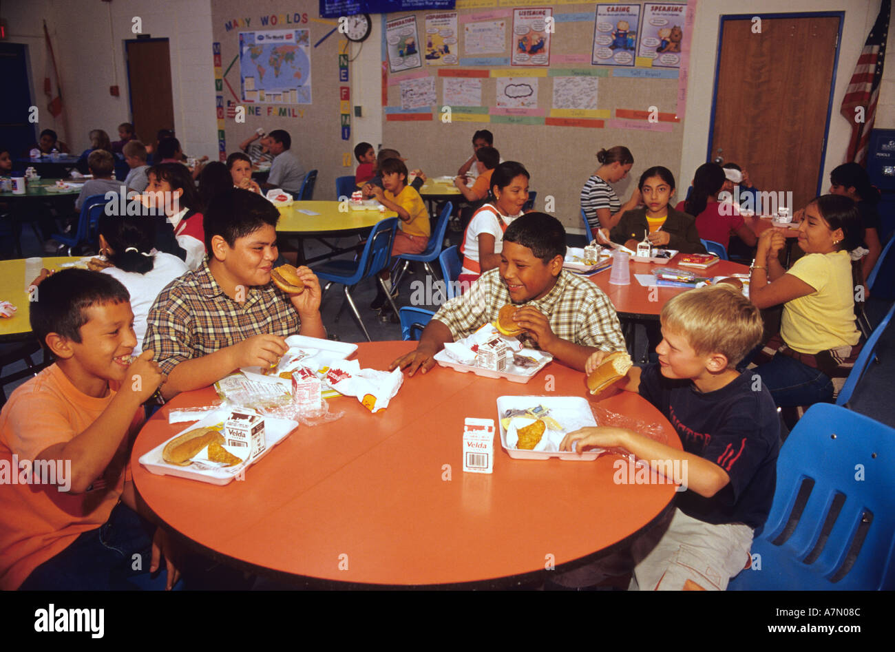 Multi ethnic children eating a school lunch in Florida Stock Photo - Alamy