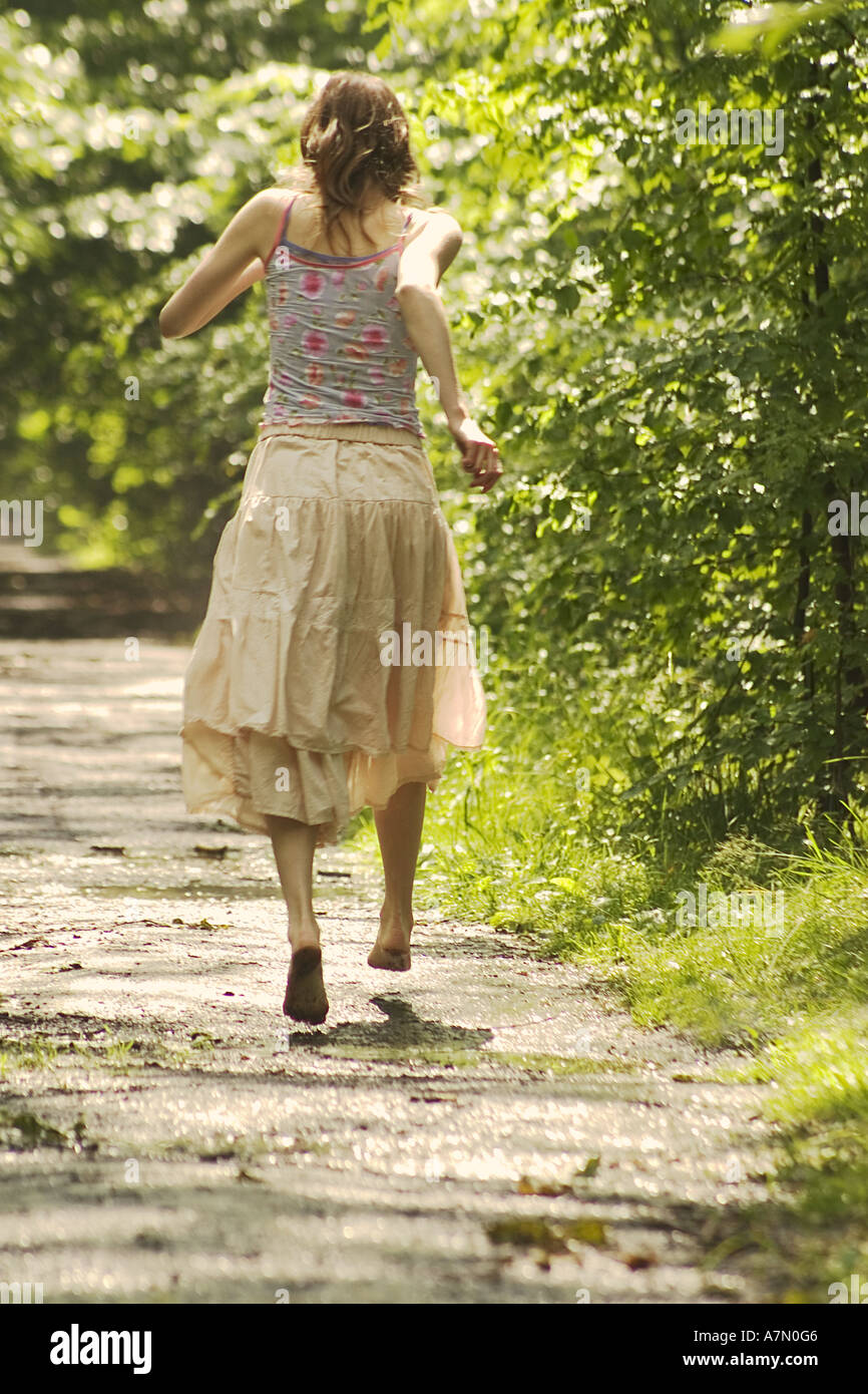 Young woman walking outdoor Stock Photo - Alamy