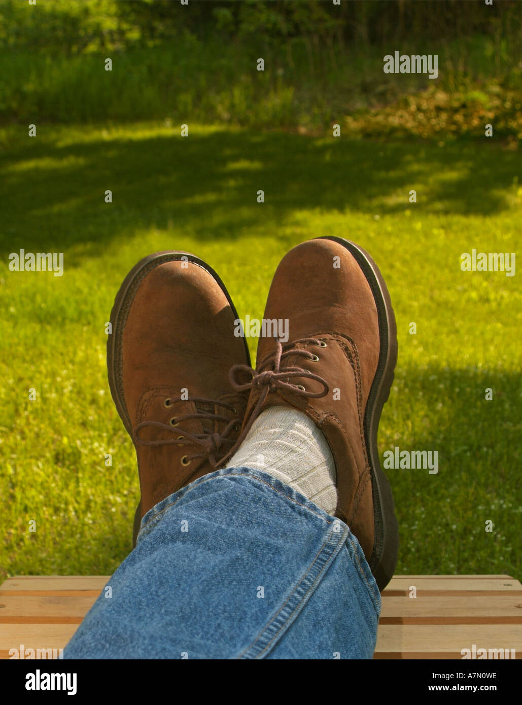 Man relaxing in backyard at home Stock Photo - Alamy