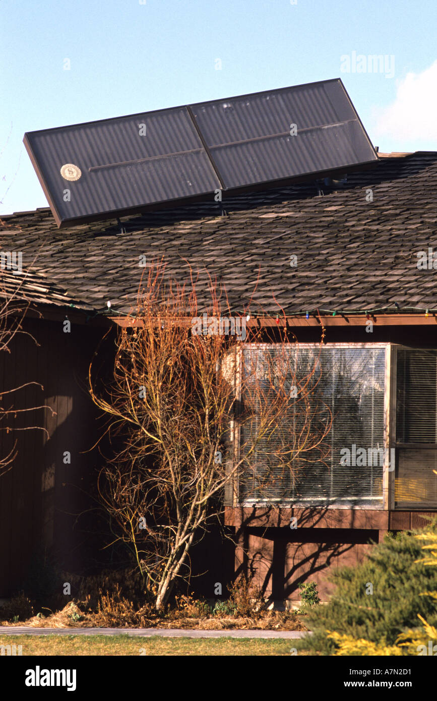House with a passive solar panel on the roof Stock Photo - Alamy