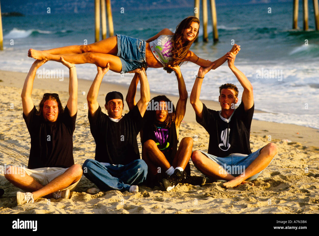 Four faces arms hi-res stock photography and images - Alamy