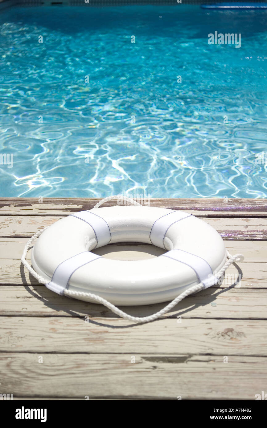 Life preserver on pool deck life jacket Stock Photo - Alamy