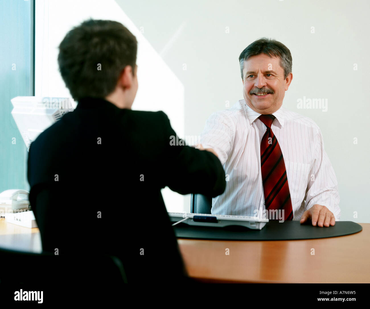 indoor business work office room people man men young boy dark hair ...