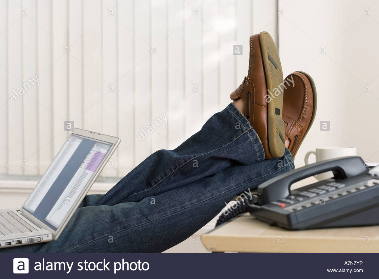 Feet Up On Desk Stock Photos & Feet Up On Desk Stock Images - Alamy
