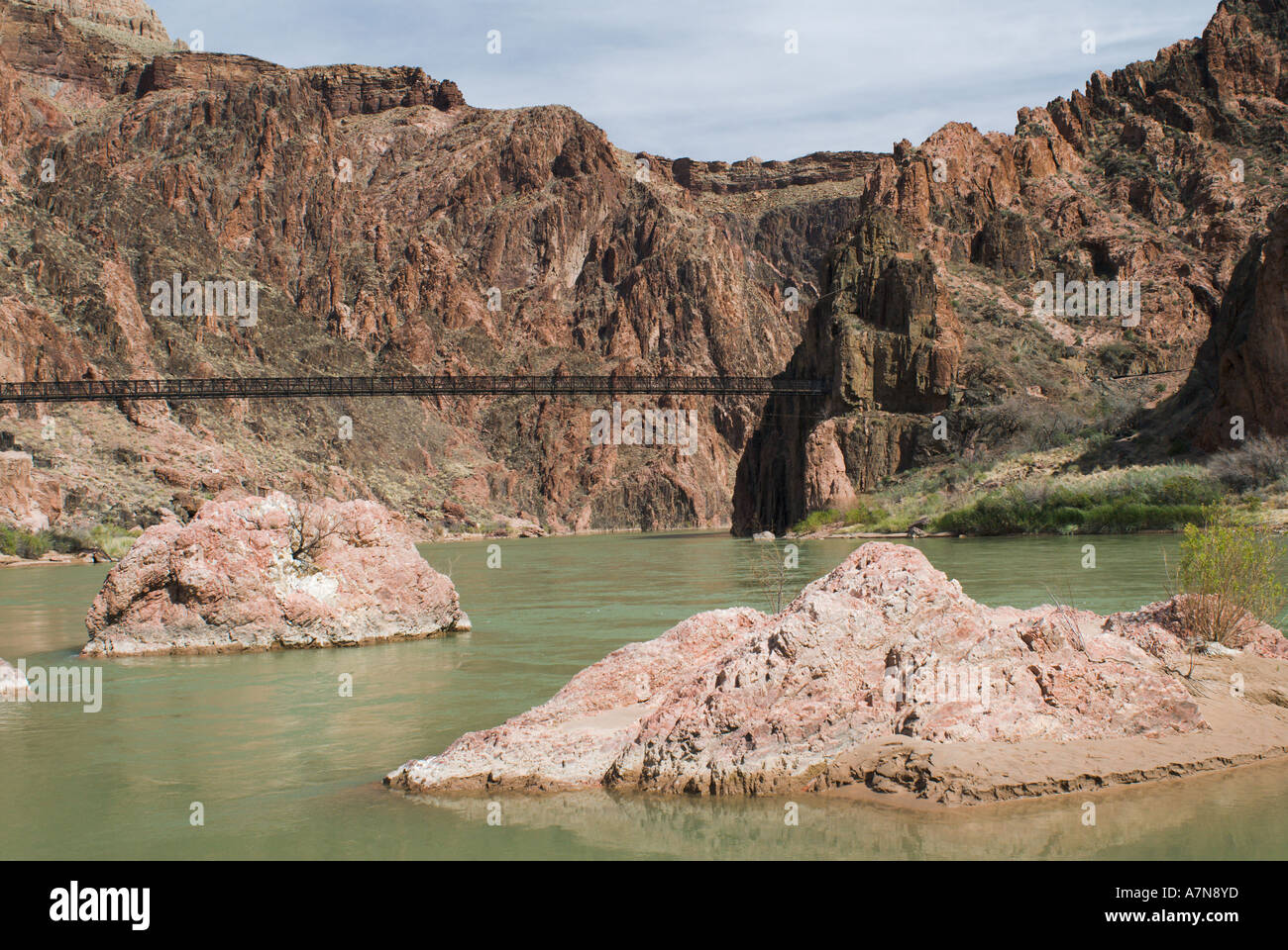 Pink granite rock outcropping in the Colorado River at the bottom of ...
