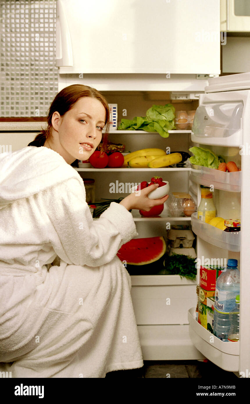 indoor flat kitchen woman young girl 20 25 red hair long bathrobe knee ...