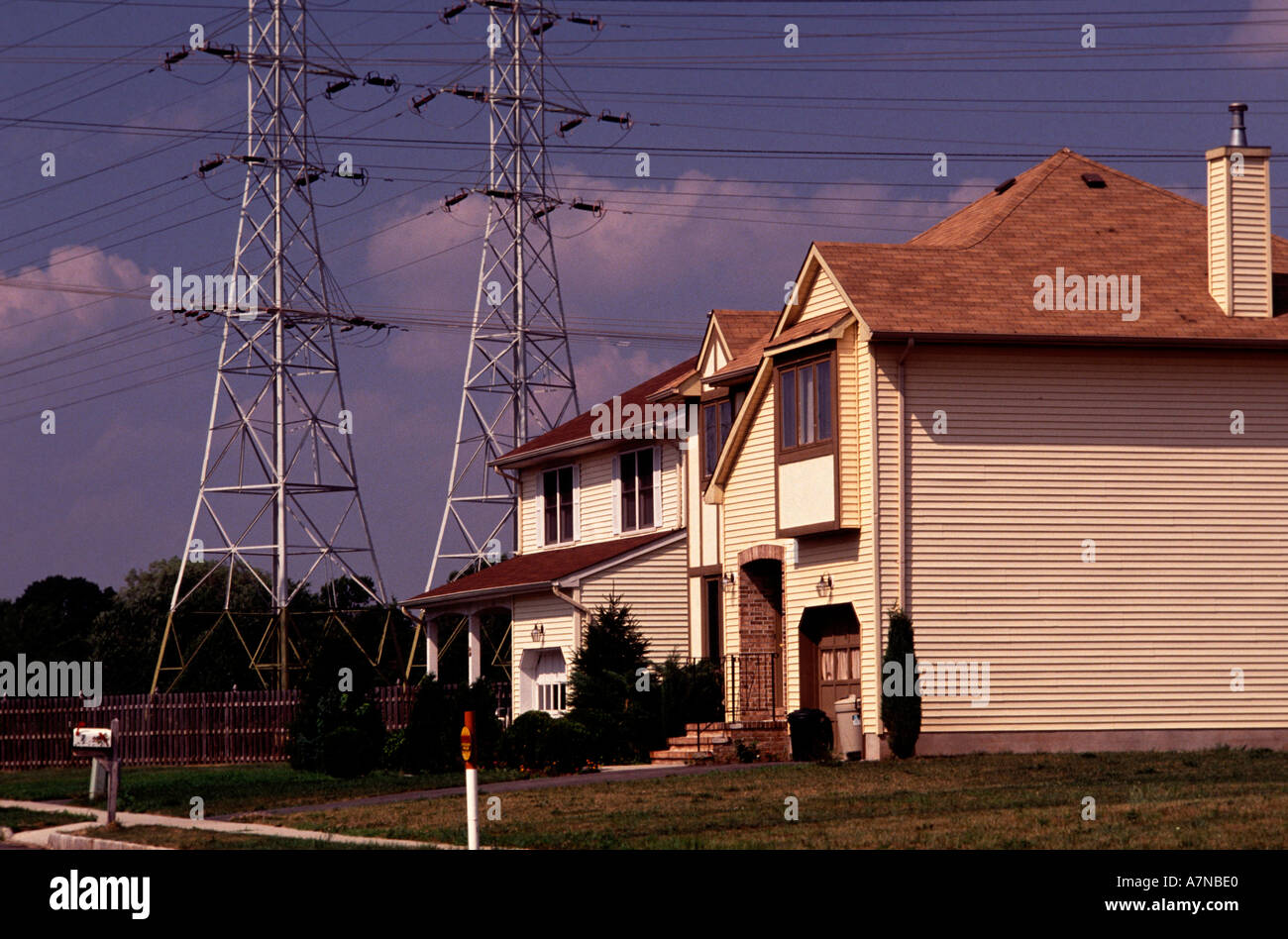 Aluminum clad suburban home beside high tension power lines Stock Photo ...