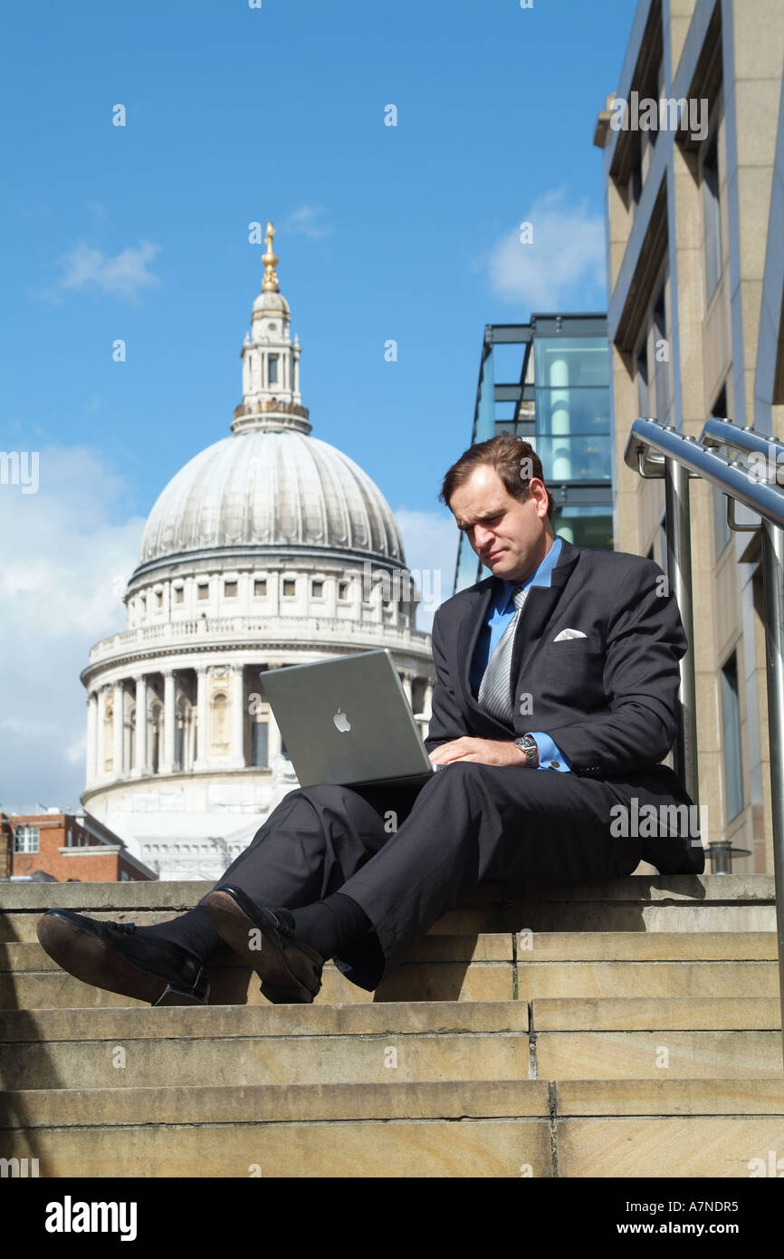 London England United Kingdom UK City gent using laptop computer in ...