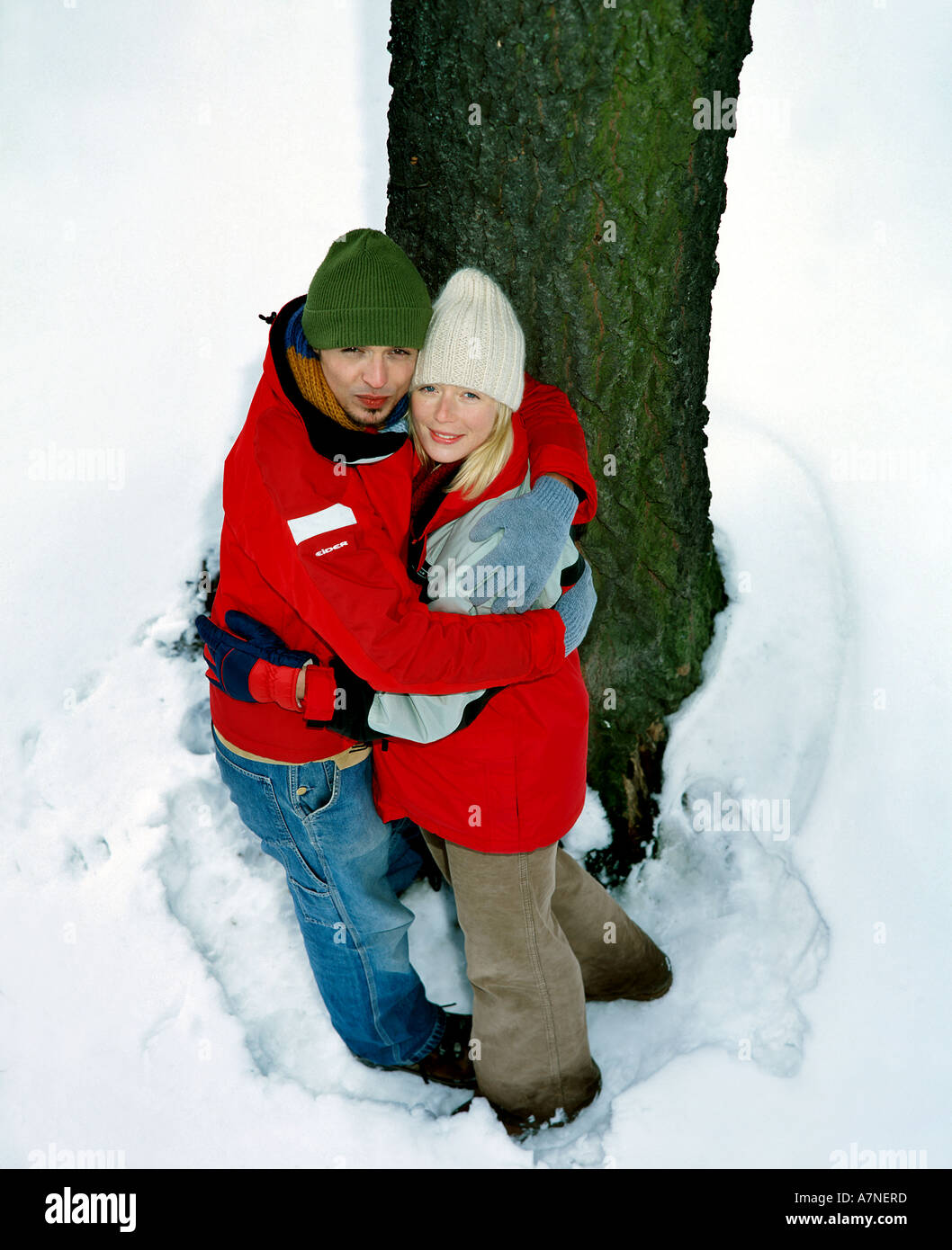 outdoor day winter snow tree woman girl man boy 20 25 young pair couple ...