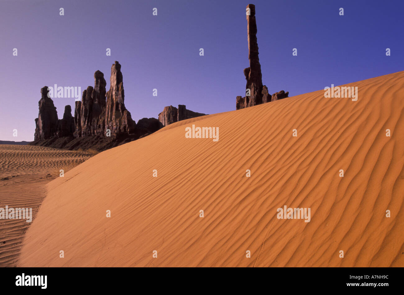 N.A., USA, Utah, Monument Valley. Desert sands and rocky spires Stock ...
