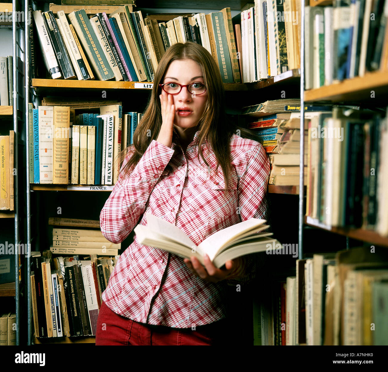 indoor library reading room shelf shelfs ledge ledges books woman young ...