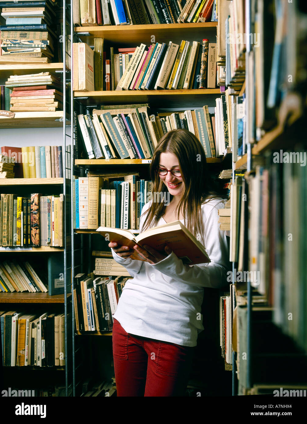 indoor library reading room shelf shelfs ledge ledges books woman young ...