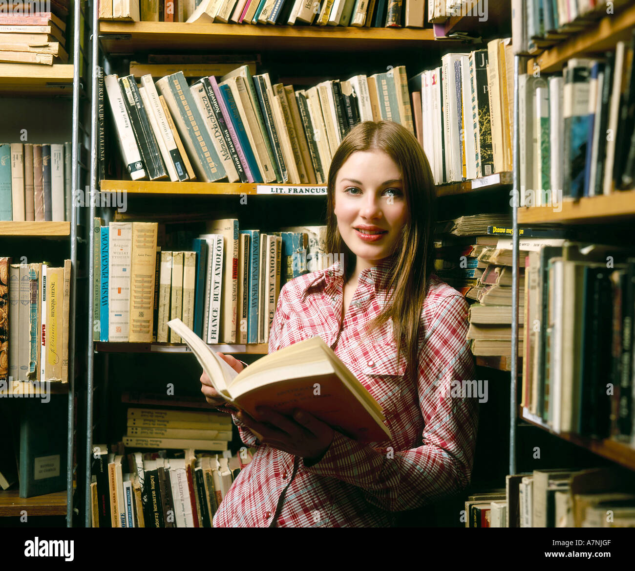 indoor library reading room shelf shelfs ledge ledges books woman young ...