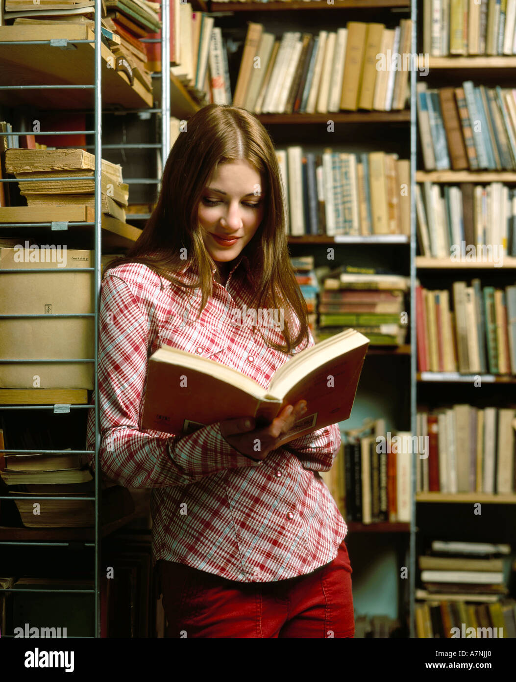 indoor library reading room shelf shelfs ledge ledges books woman young ...