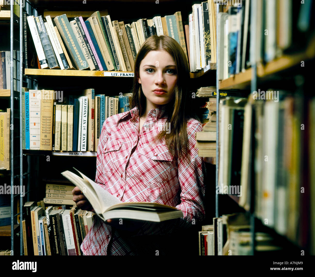 indoor library reading room shelf shelfs ledge ledges books woman young ...