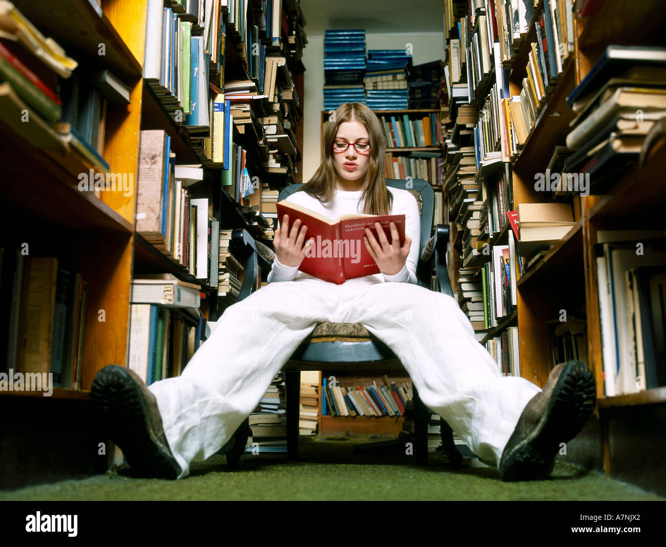 indoor library reading room shelf shelfs ledge ledges books woman young ...