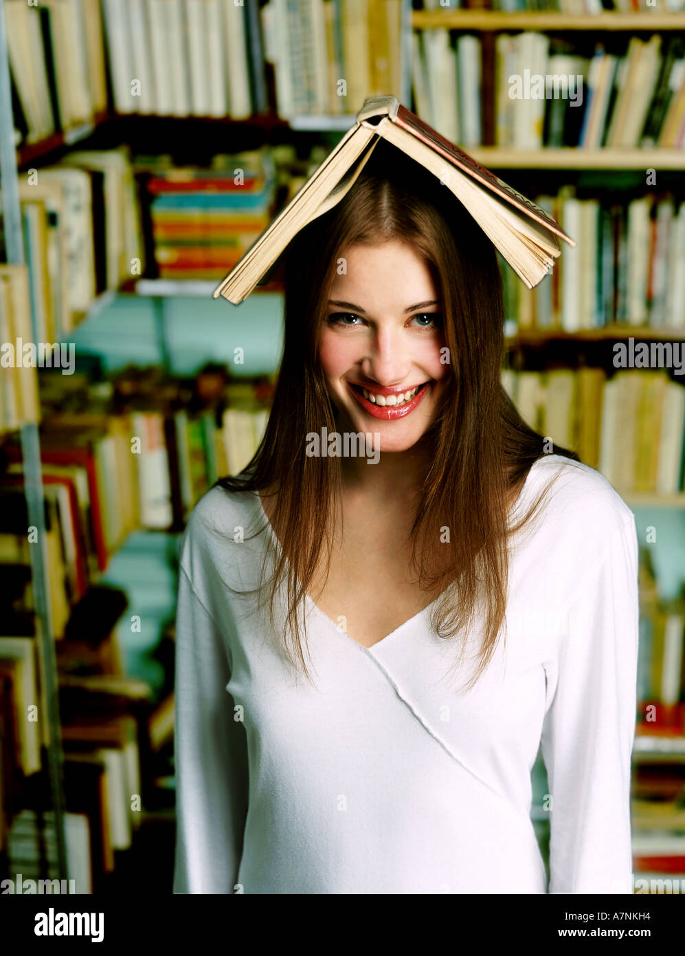 indoor library reading room shelf shelfs ledge ledges books woman young ...