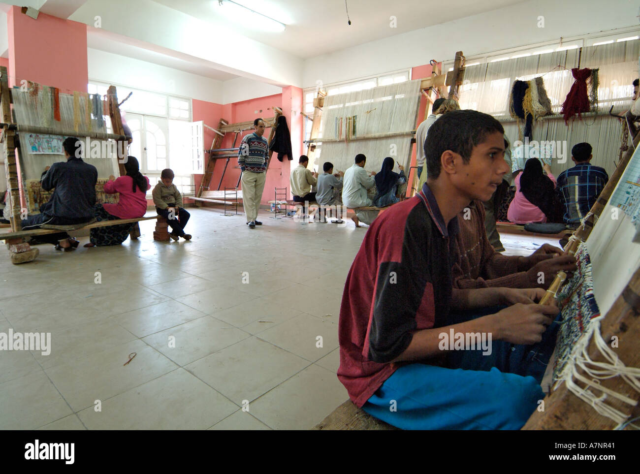 Children working africa factory hi-res stock photography and images - Alamy