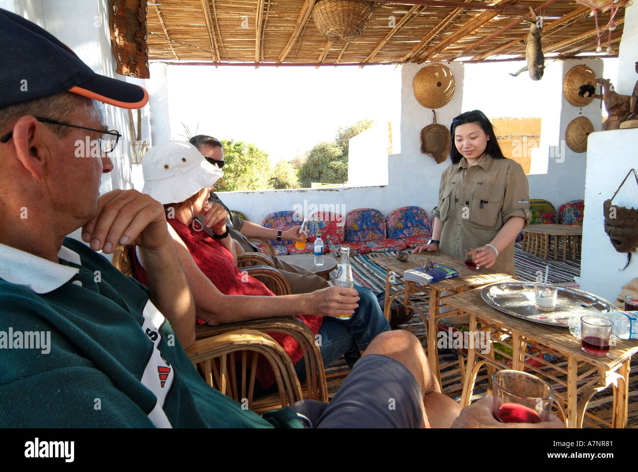 Group having tea in a Nubian house, Elephantine Island, Aswan, Egypt ...