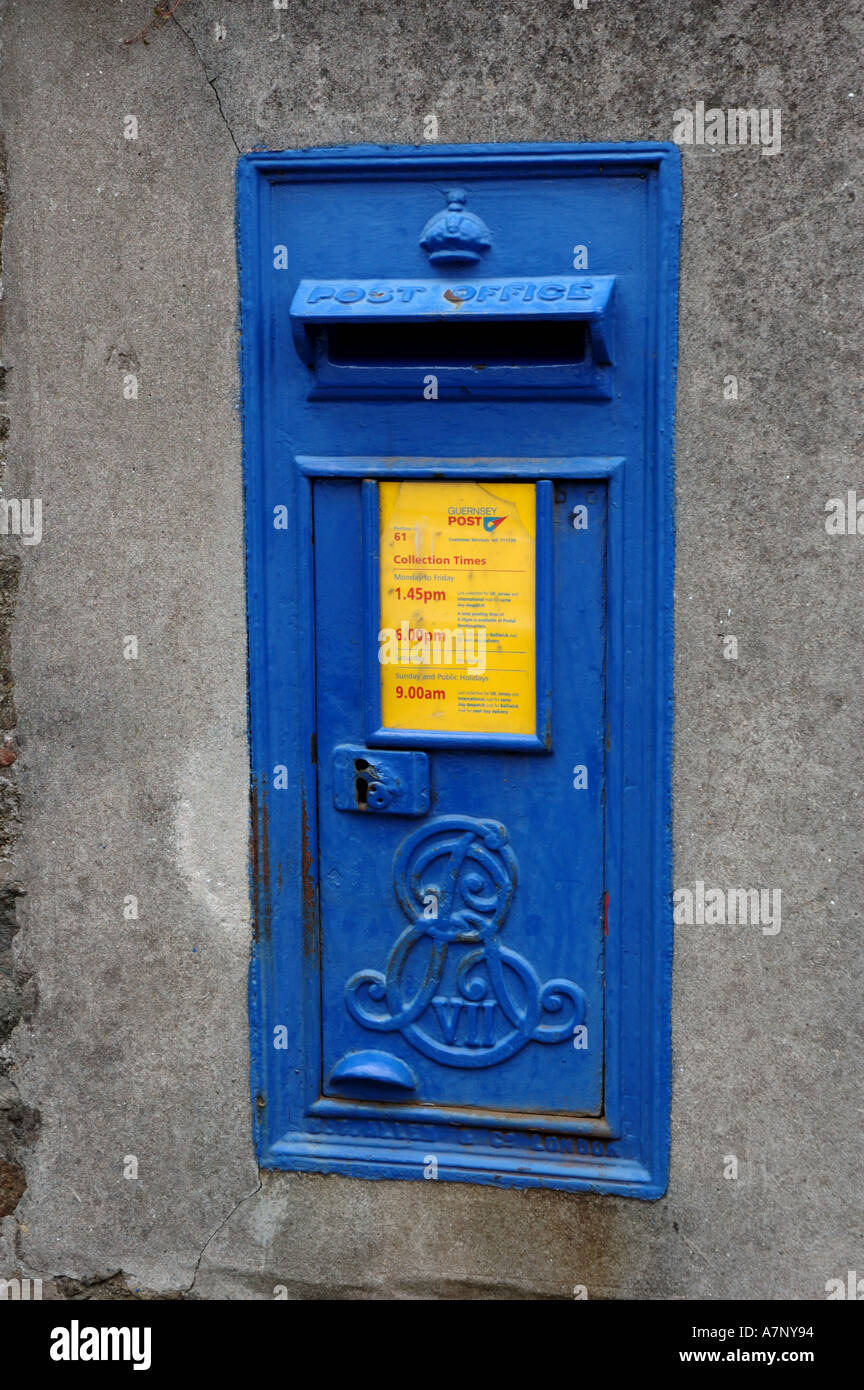 Blue post box in a wall in St Peter Port in Guernsey, Channel Islands ...