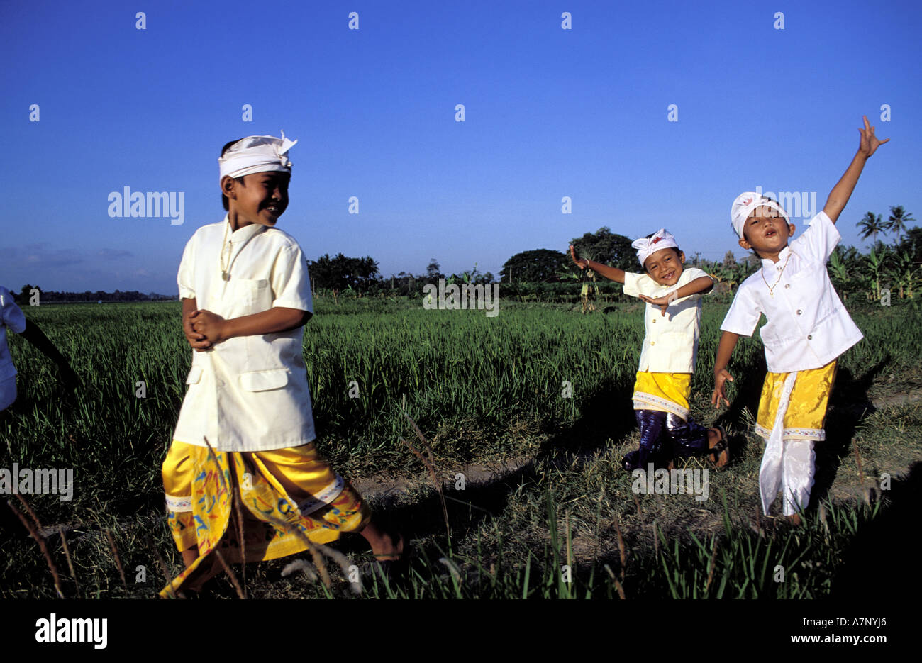 Indonesia, Bali, children enjoy in return from the full moon procession ...