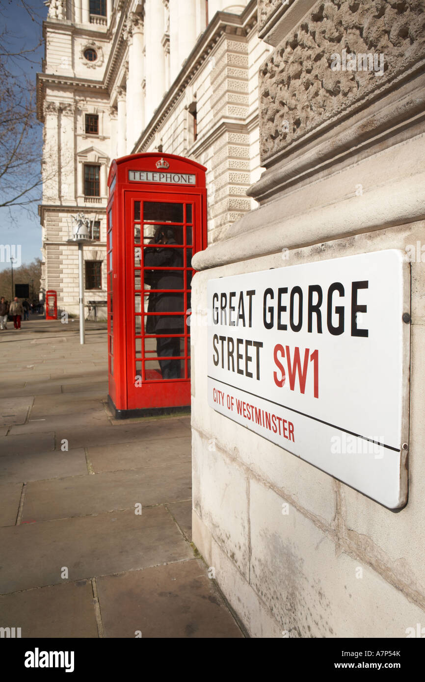 Red telephone box and Great George Street SW1 road sign outside ...