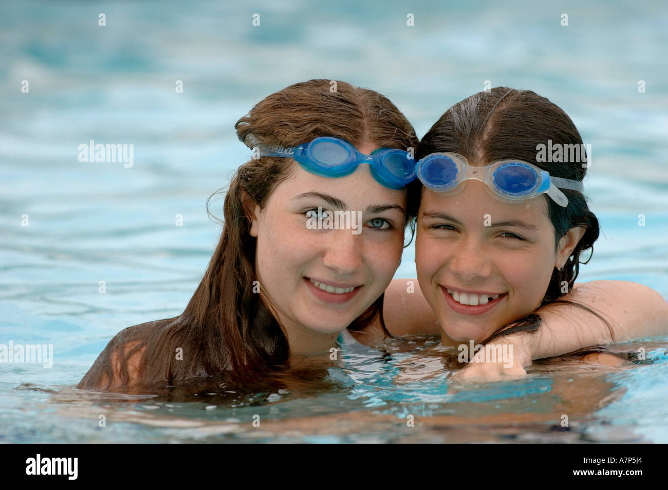 Two girls swimming hi-res stock photography and images - Alamy