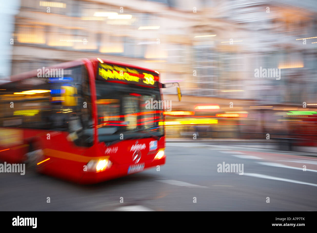 Red single deck bus driving past the Trocadero Centre along Haymarket ...