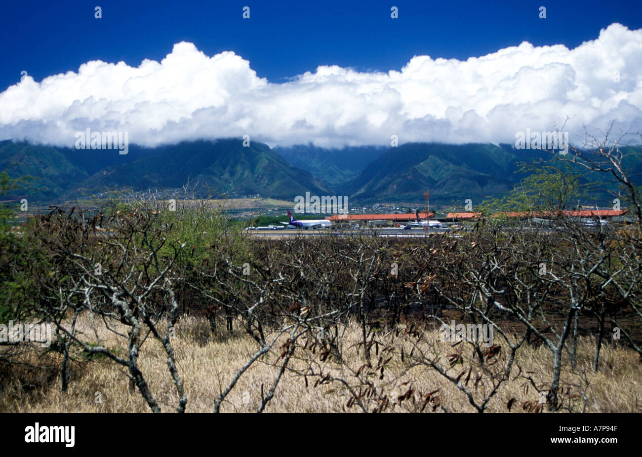 Kahalui airport on the Hawaiian island of Maui with the cloud-covered ...