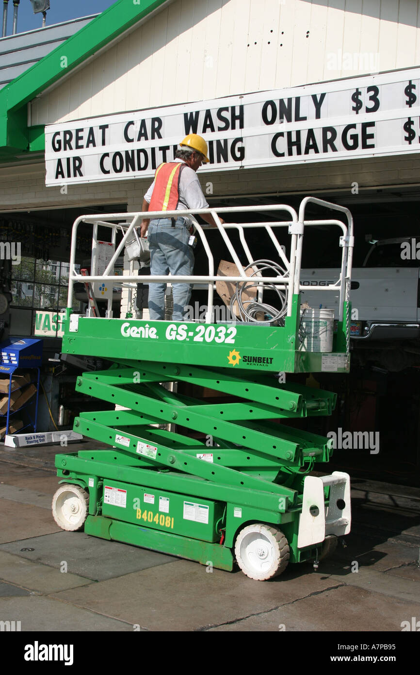 Miami Beach Florida,BP,gas station,petrol,lift,rolling platform,worker ...