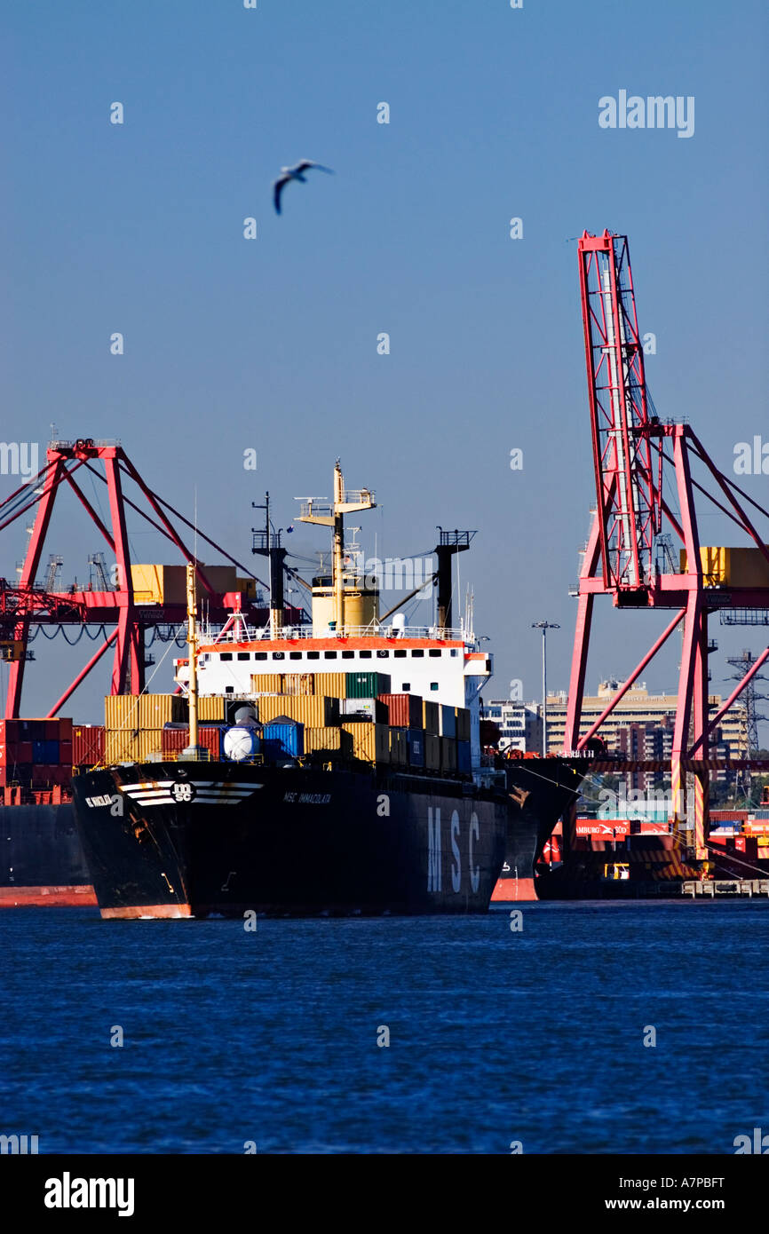 Shipping Industry / A container ship is outbound in the Port of ...