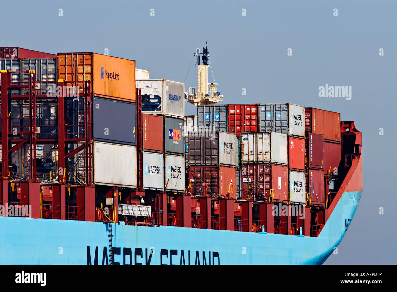 Shipping Industry / A Container Ship with a load of containers stacked ...