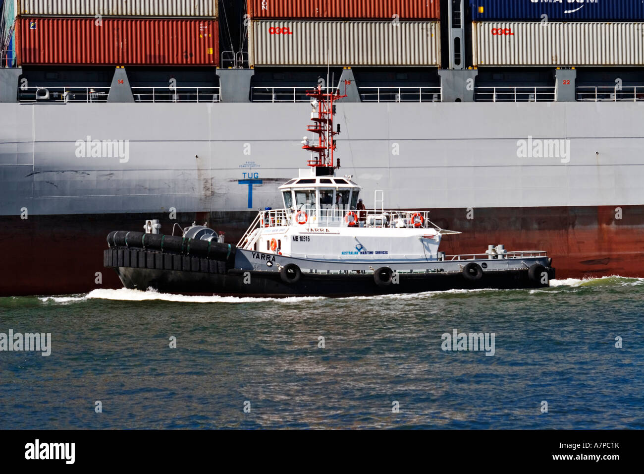 Shipping Industry / A Container Ship is inbound with a tugboat ...