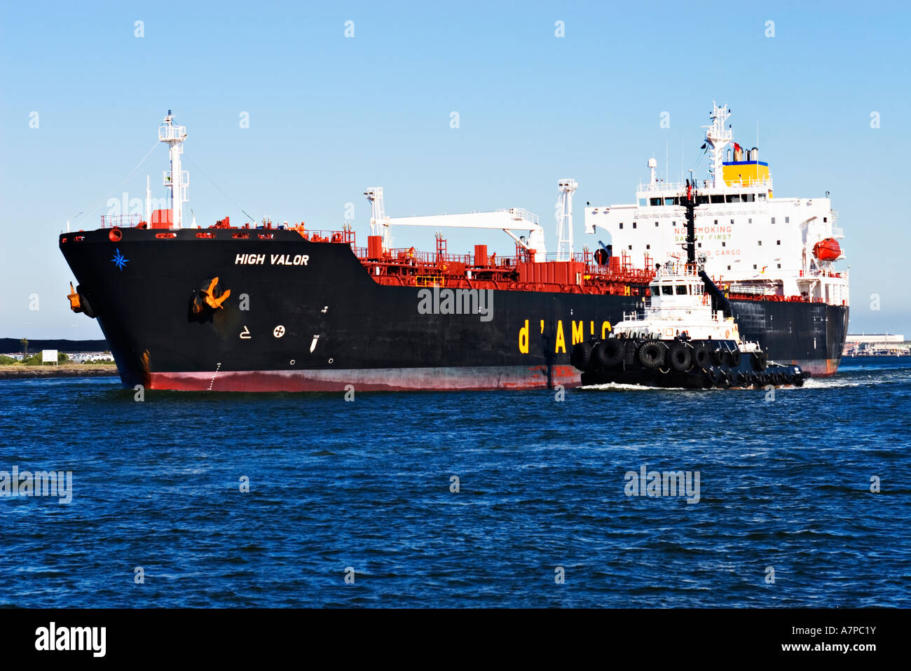 Shipping Industry / A Petroleum Tanker Ship and assisting Tugboat ...