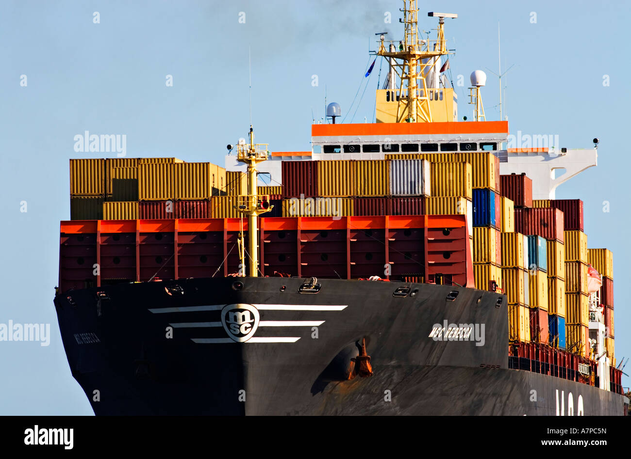 Shipping Industry / Shipping Containers stacked high on the deck of a ...