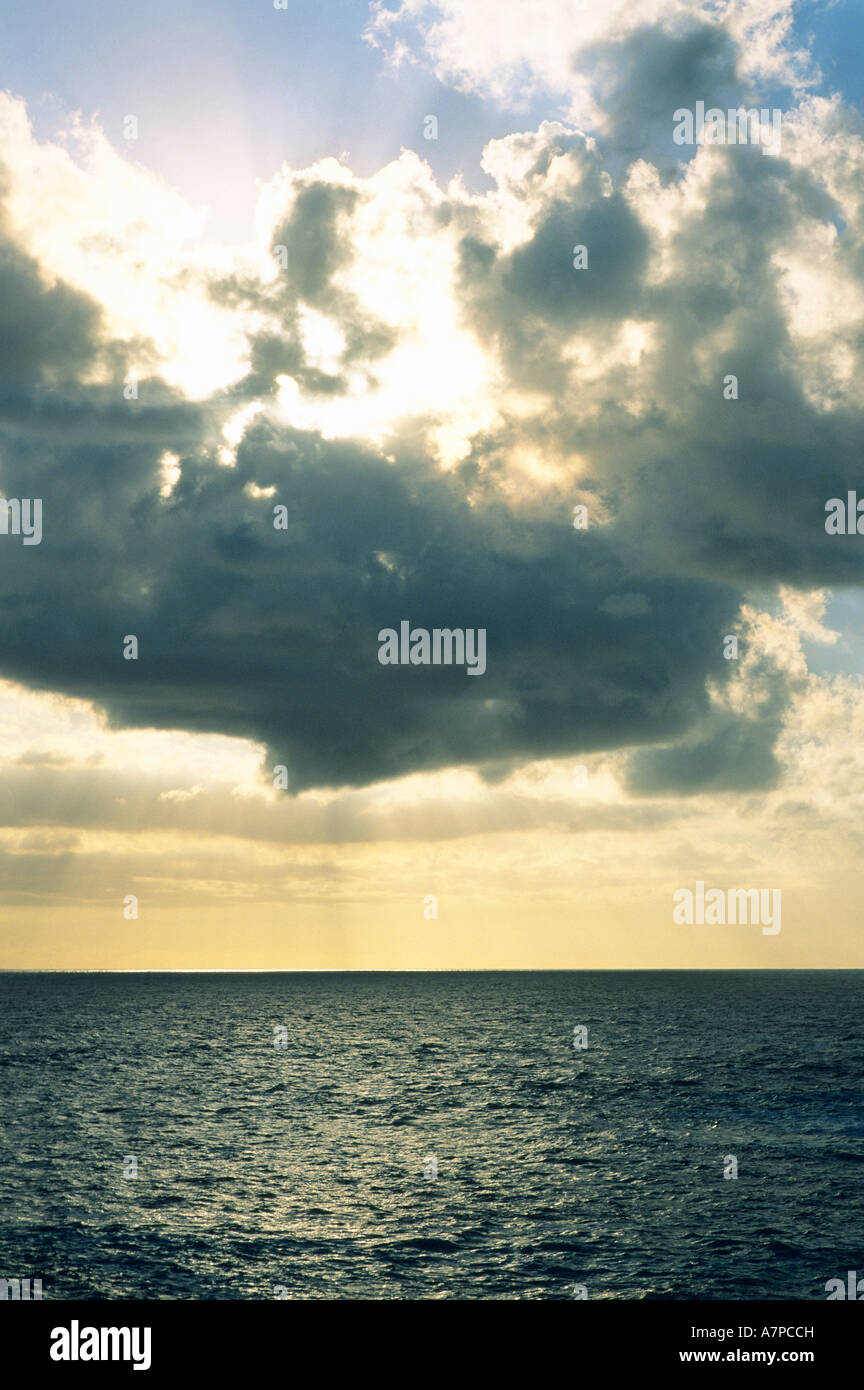 Sun clouds and crepescular rays over the Pacific Ocean Island of Guam ...