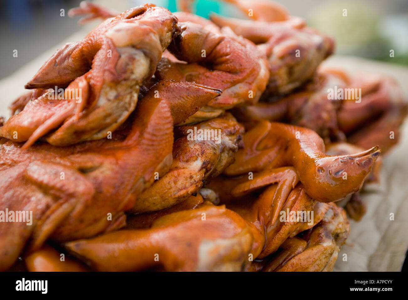 Chicken being prepared at a roadside food stall in downtown Phnom Penh ...