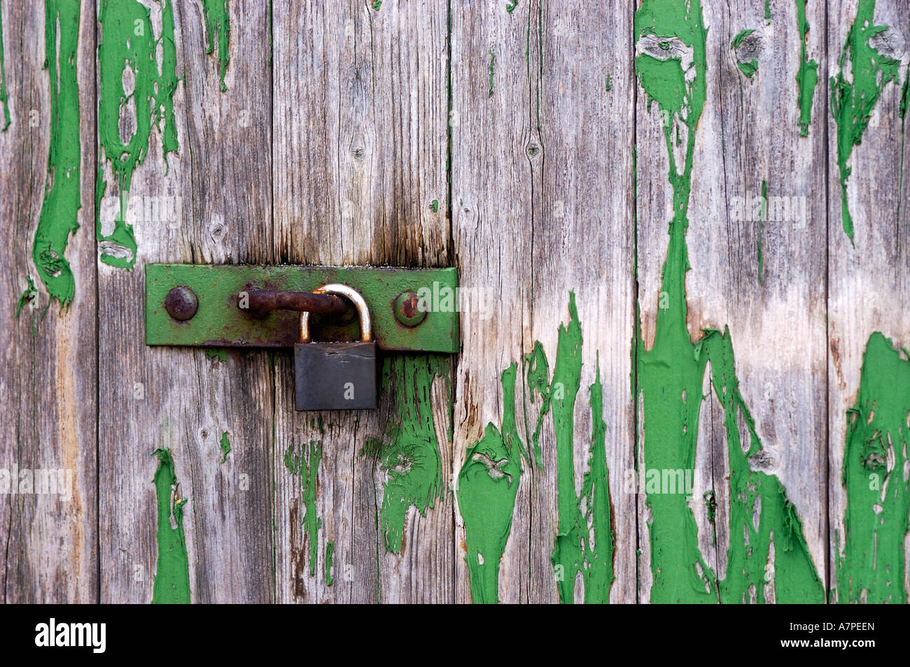 Locked rotting door Stock Photo - Alamy