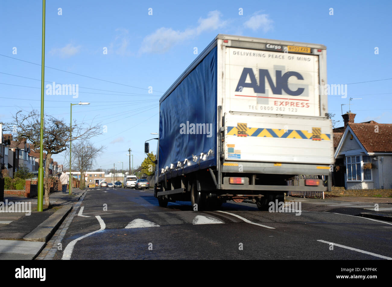 Lorry passing over a speed hump Stock Photo - Alamy
