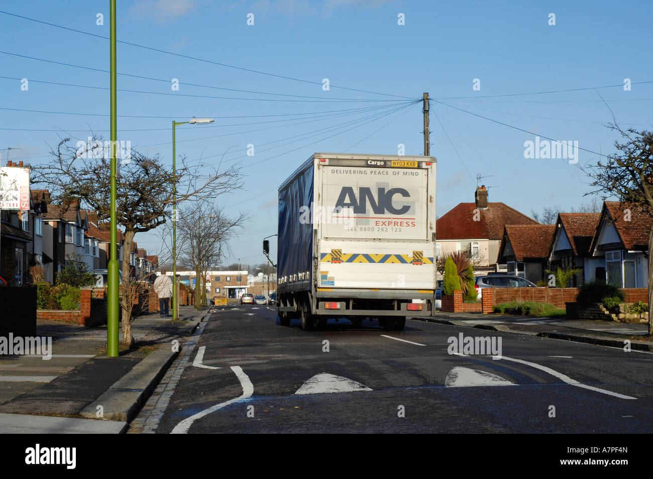 Lorry passing over a speed hump Stock Photo - Alamy