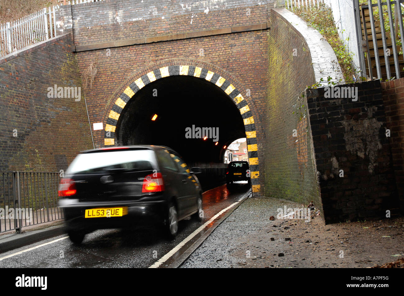 Car driving through narrow street hi-res stock photography and images ...