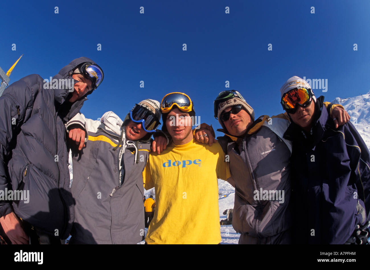Group of males snowboarding friends posing on the slopes Stock Photo ...