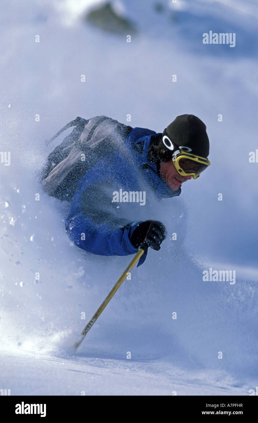 Generic close up of a male skier in very deep powder snow off piste ...