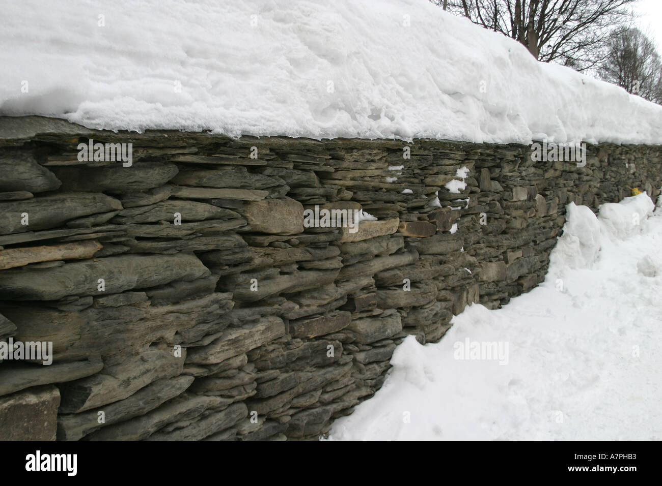 Rock Wall in Winter Stock Photo - Alamy